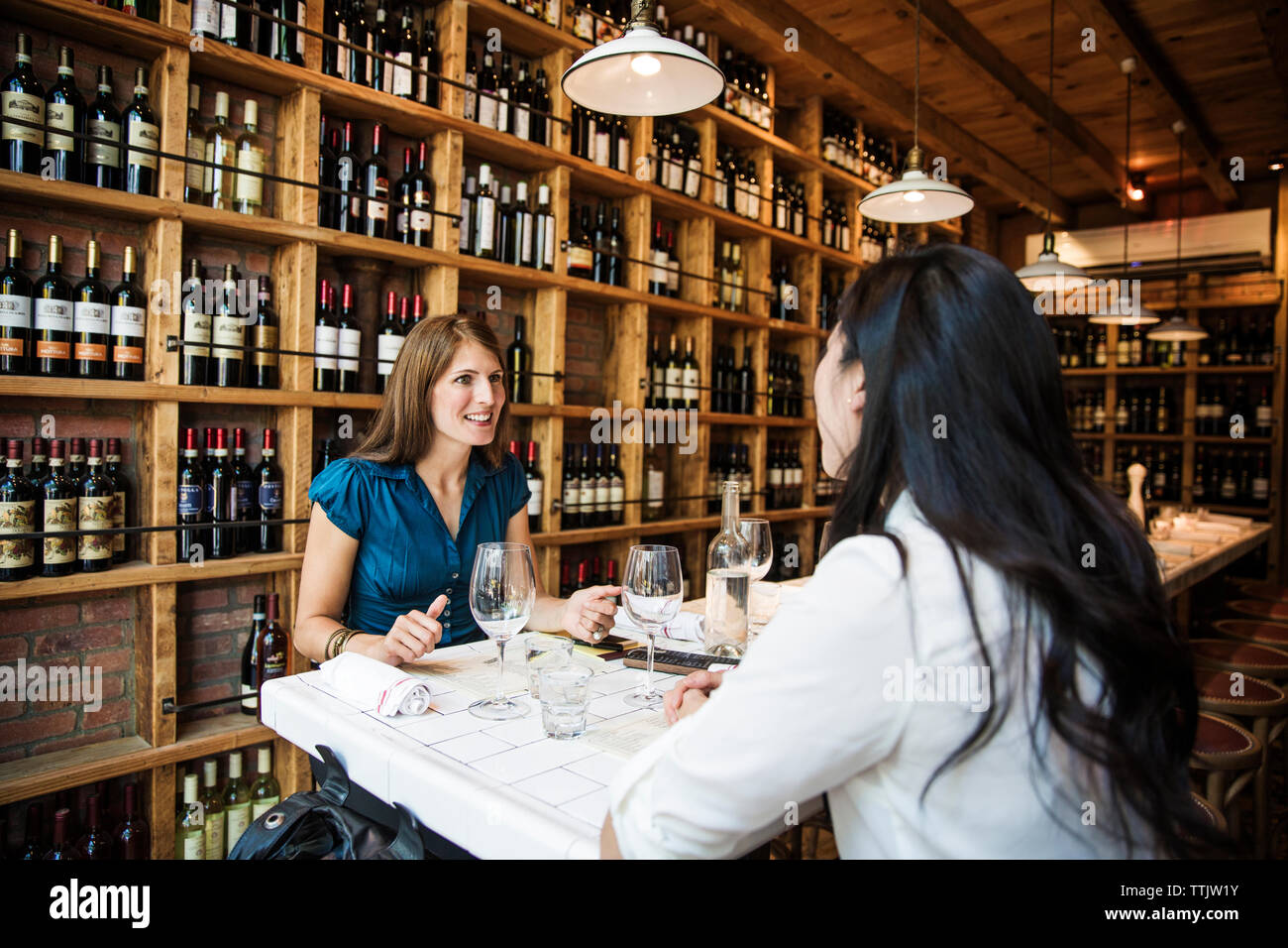 People talking in front of the bar hi-res stock photography and images ...