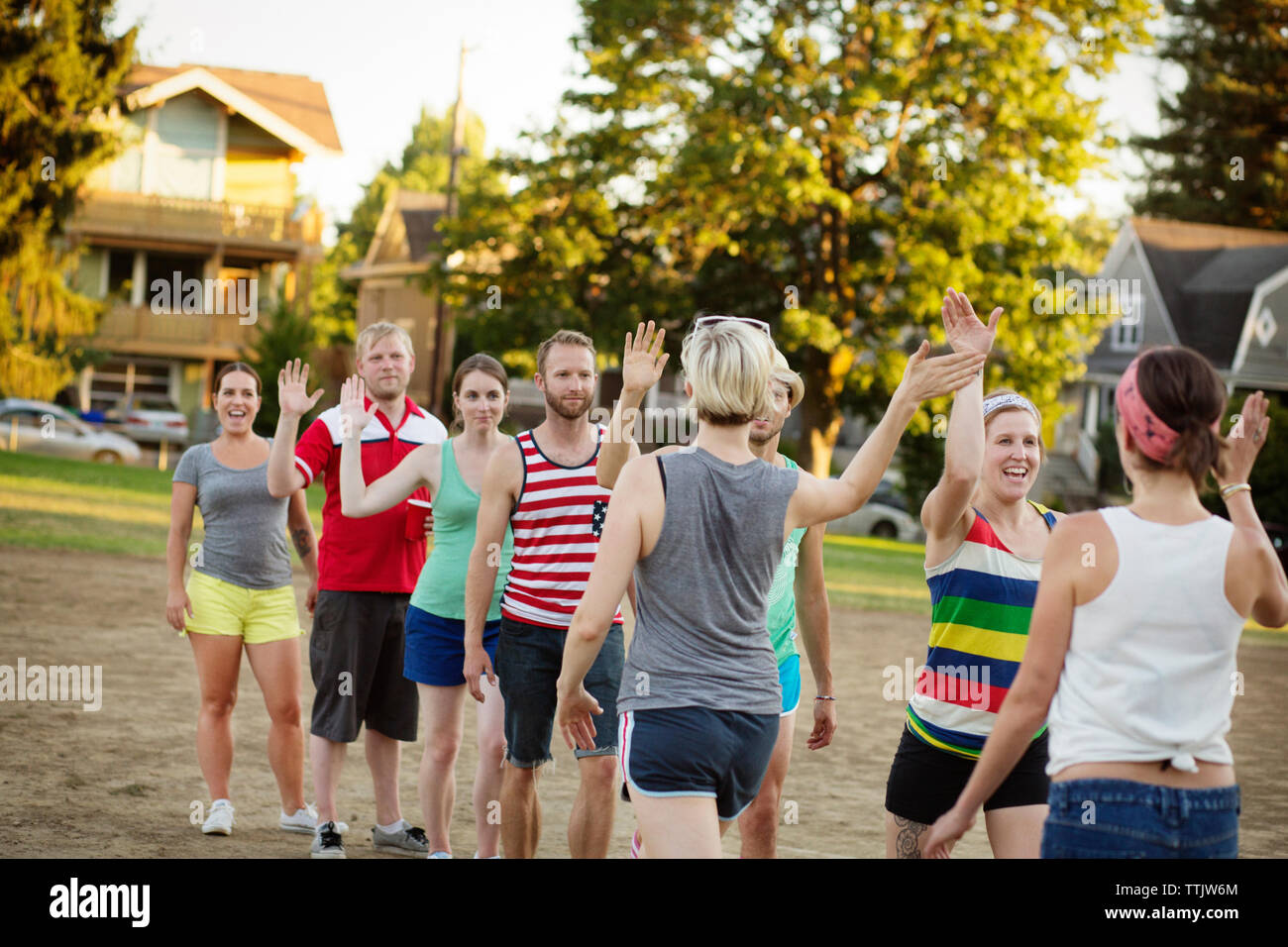 Friends high fiving hi-res stock photography and images - Alamy