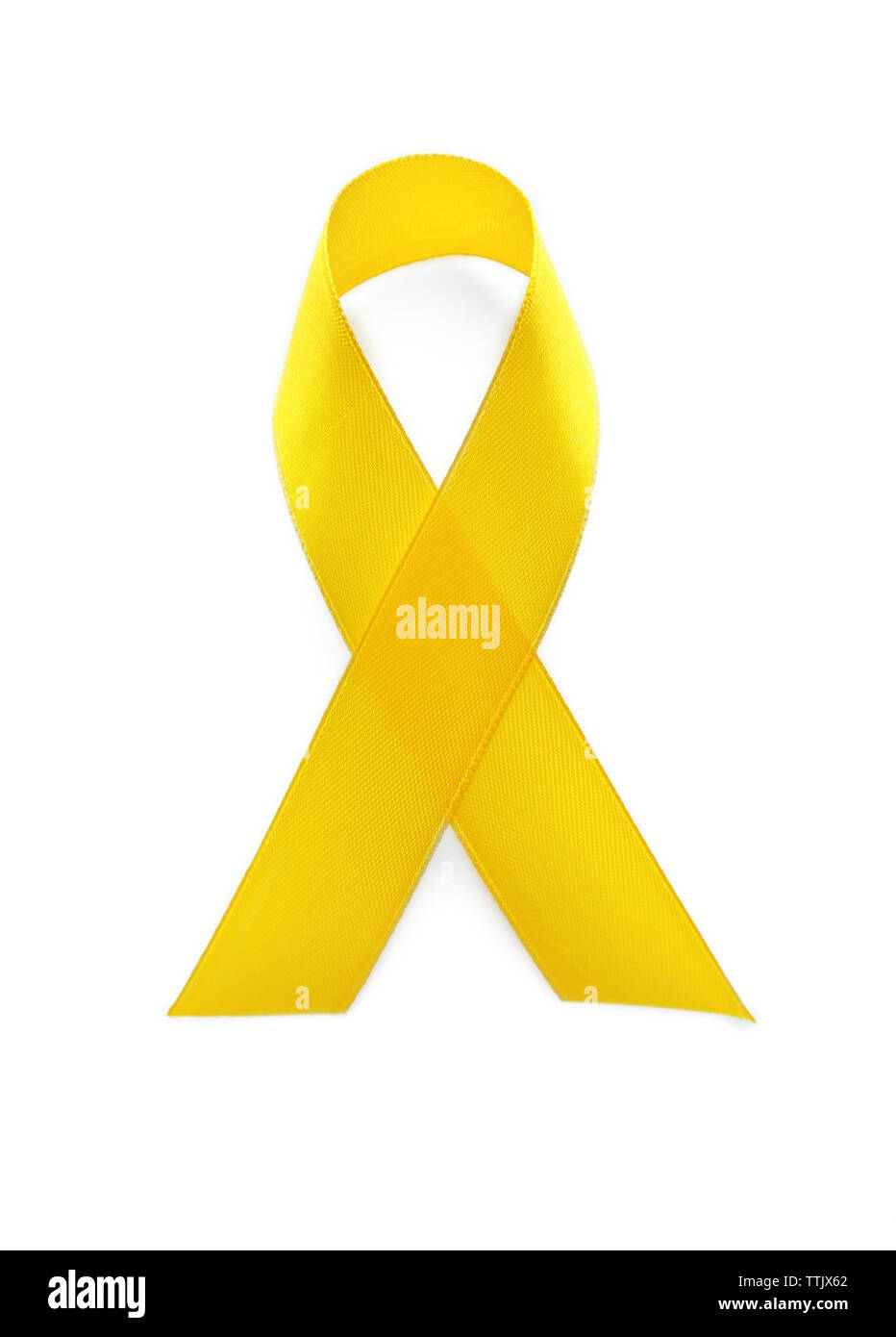 Yellow awareness ribbon on light background Stock Photo - Alamy