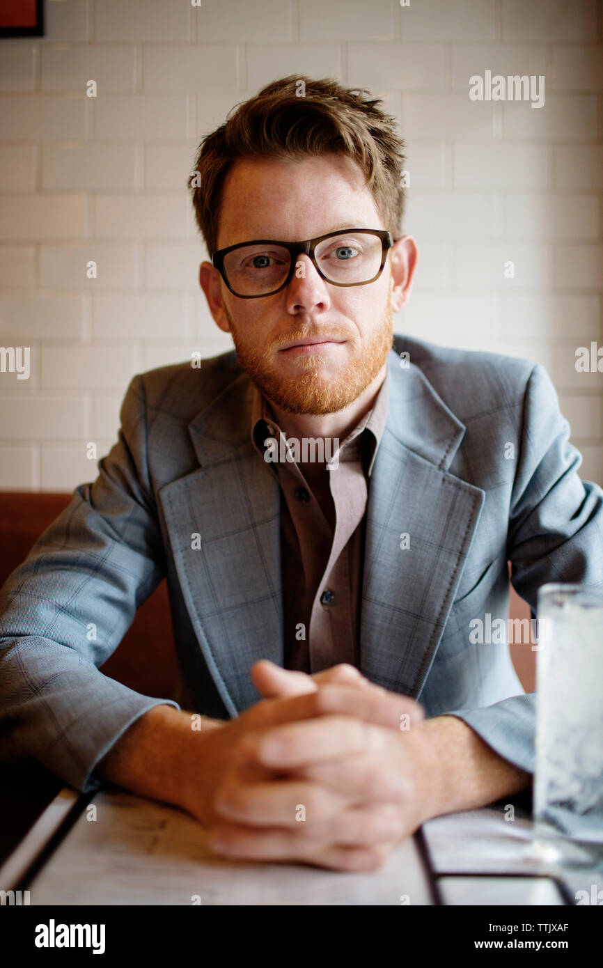Portrait of man sitting in restaurant Stock Photo - Alamy