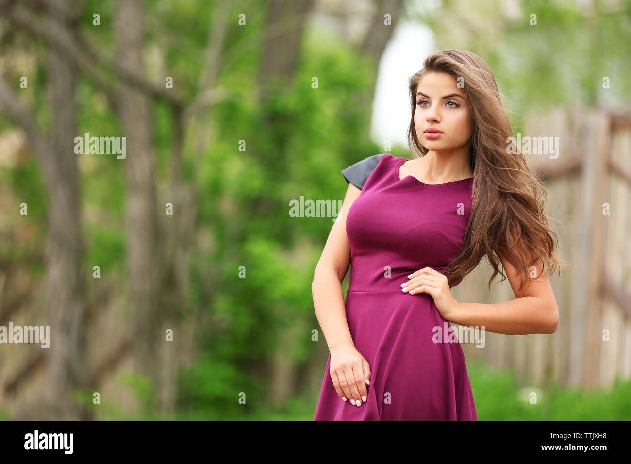 Pretty young woman in dress outdoor Stock Photo - Alamy