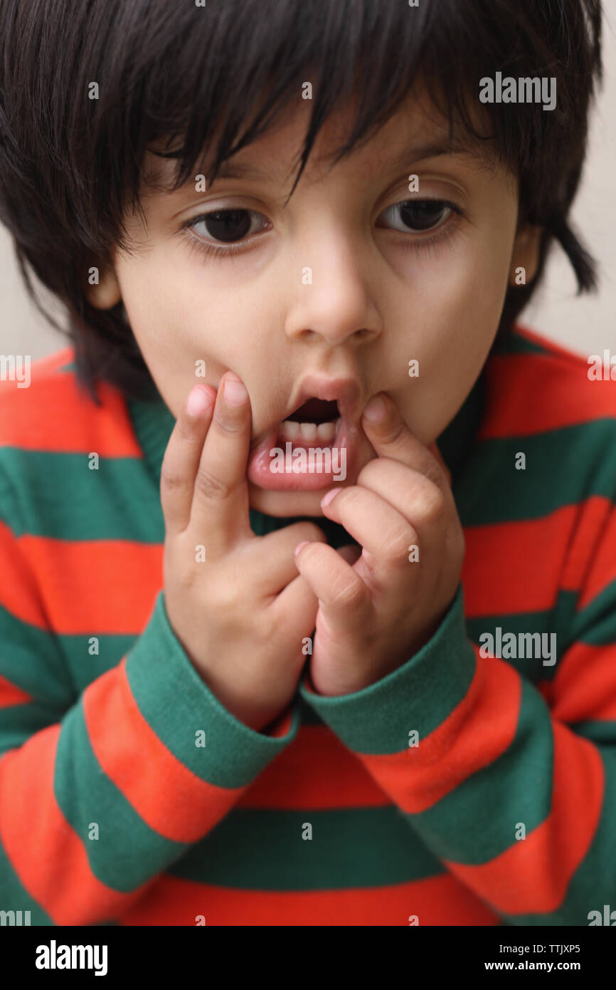 Child making funny faces hi-res stock photography and images - Alamy