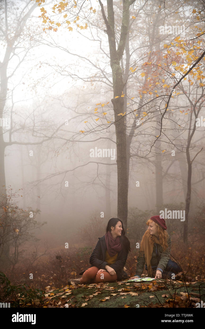 Smiling friends map in hi-res stock photography and images - Alamy
