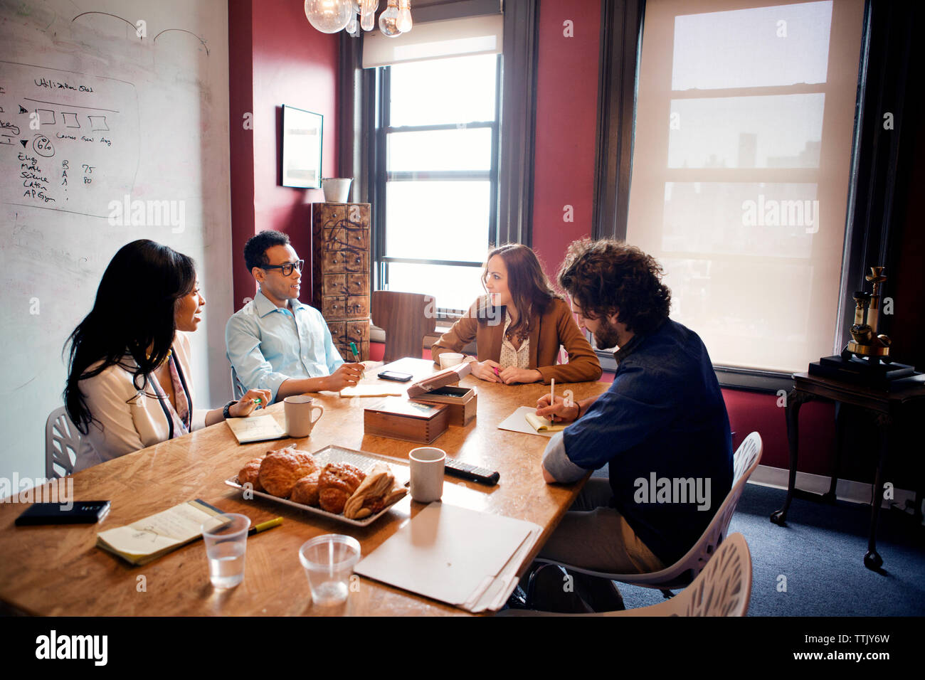 business people discussing during meeting in office Stock Photo - Alamy