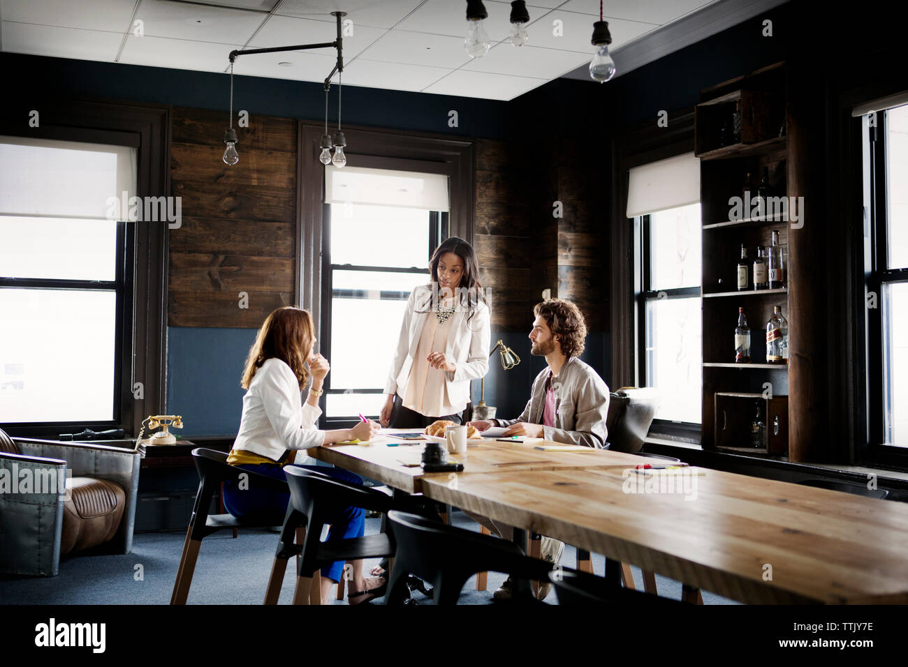 Three people sitting discussion hi-res stock photography and images - Alamy