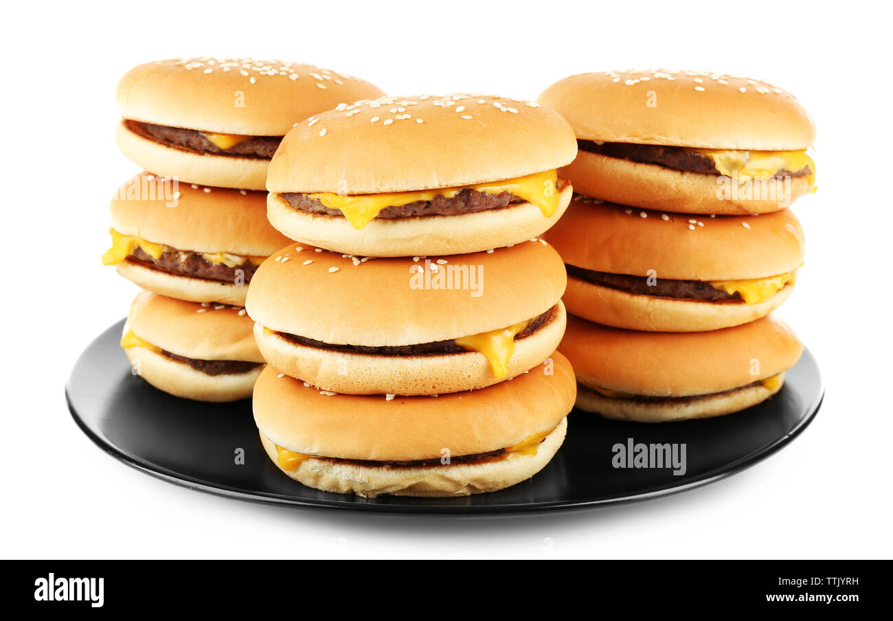 Tasty cheeseburgers on plate, isolated on white Stock Photo - Alamy