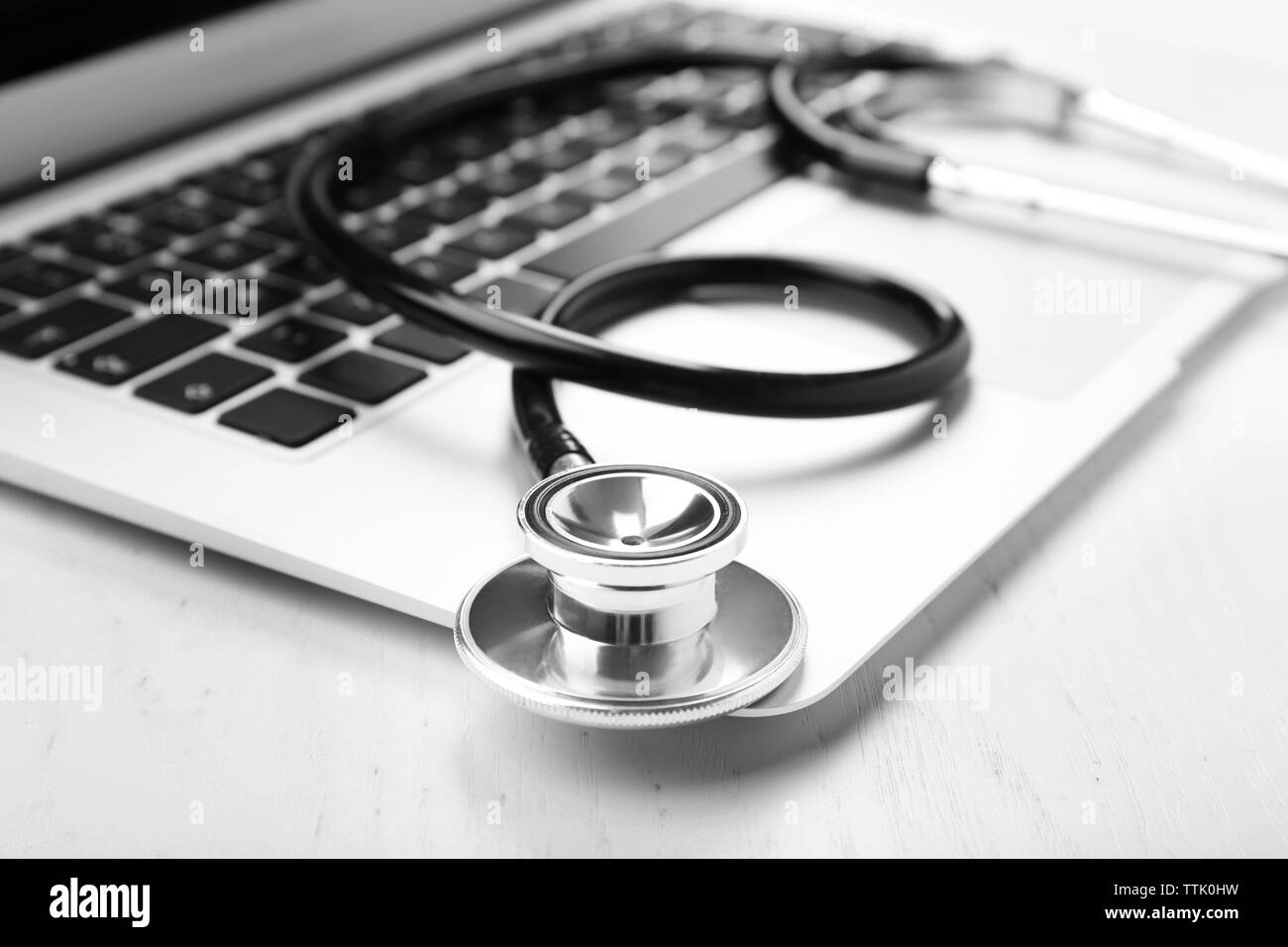 Laptop black stethoscope on Black and White Stock Photos & Images - Alamy