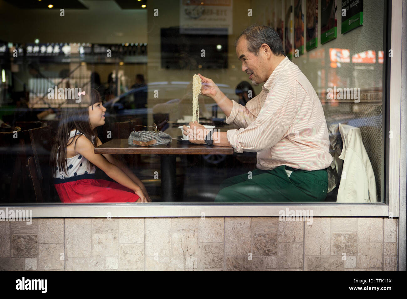 Indian group people eating noodles hi-res stock photography and images ...