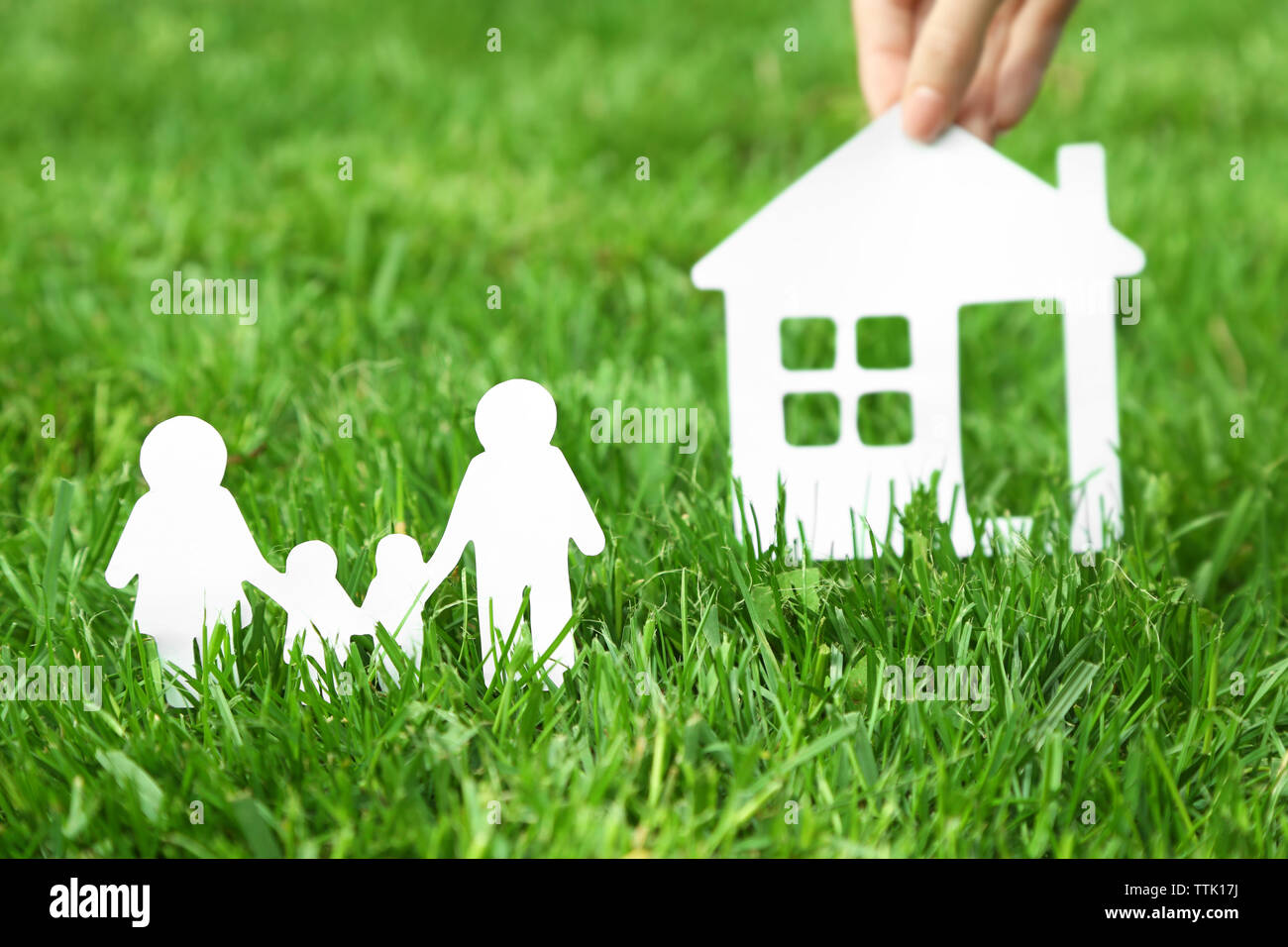 Woman hand holding wooden family shape. Love and relationships concept ...