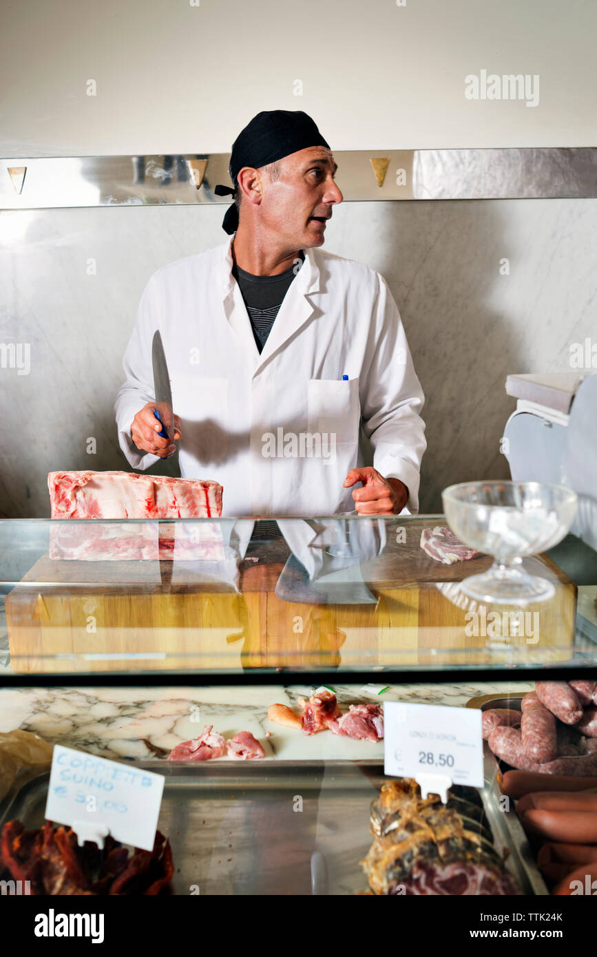 Male butcher working with meat hi-res stock photography and images - Alamy