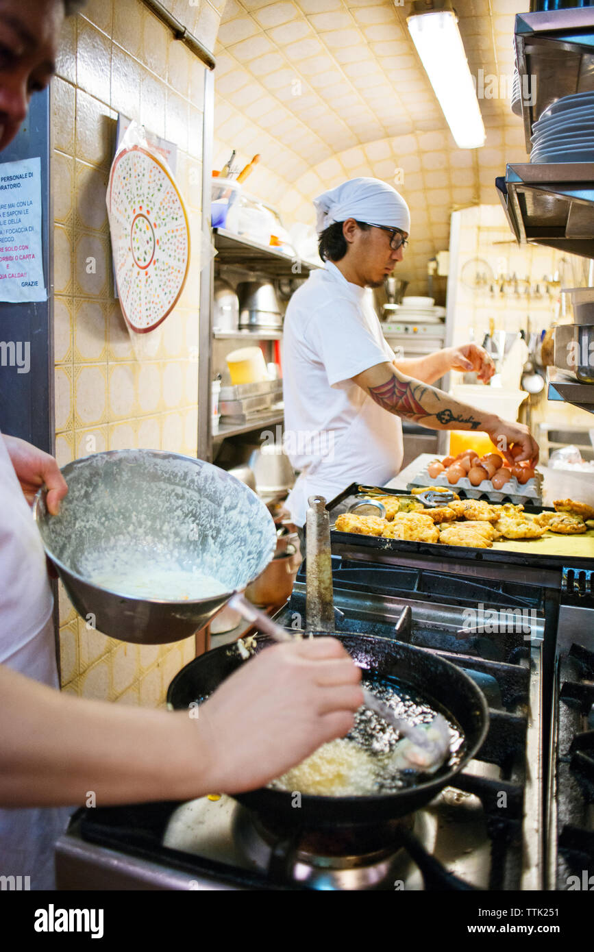 Chefs preparing sweet food at bakery Stock Photo - Alamy