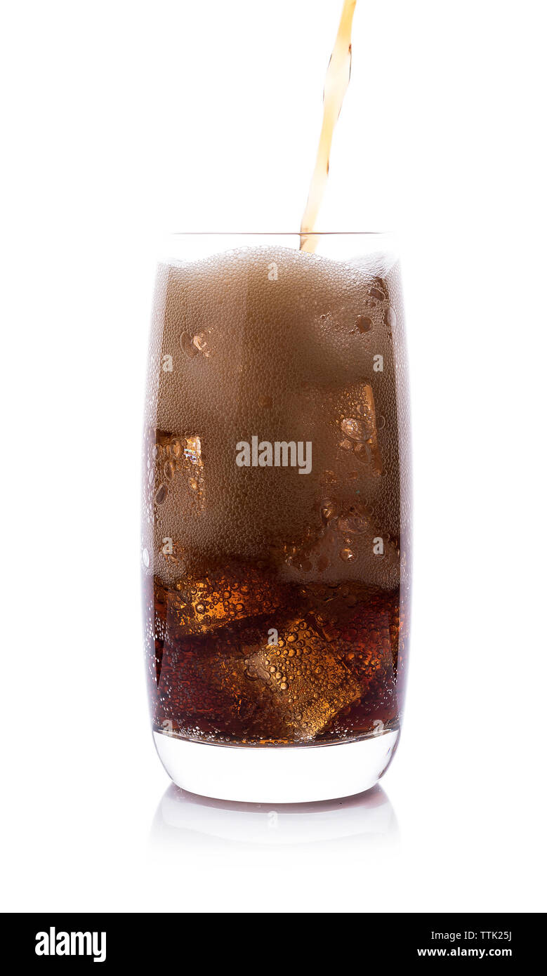 Bottle pouring Cola in drink glass with ice cubes Stock Photo - Alamy