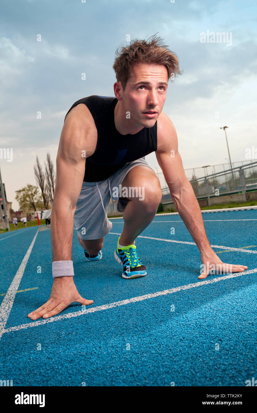 Athlete on running track Stock Photo - Alamy