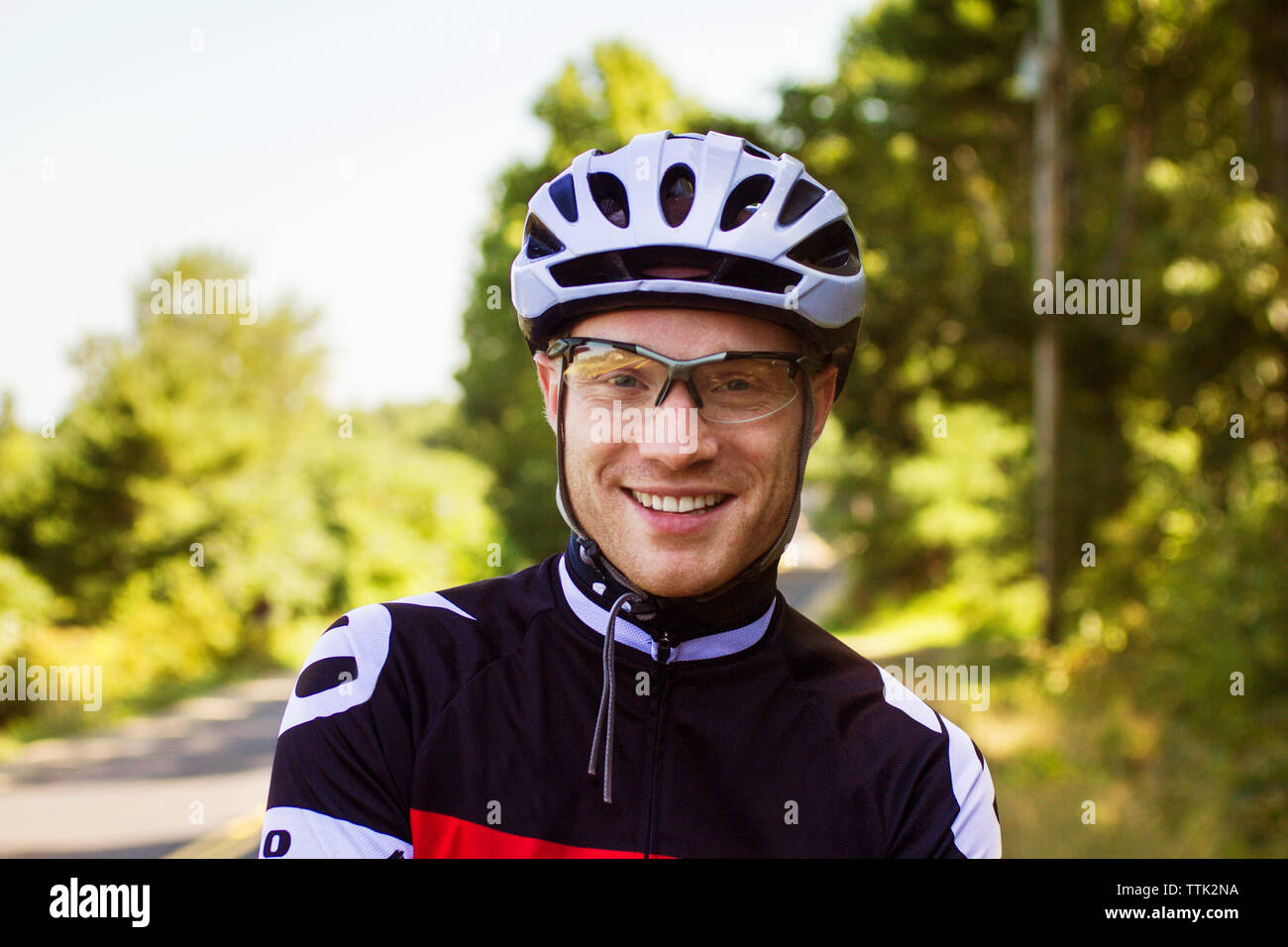 Portrait of smiling athlete Stock Photo - Alamy