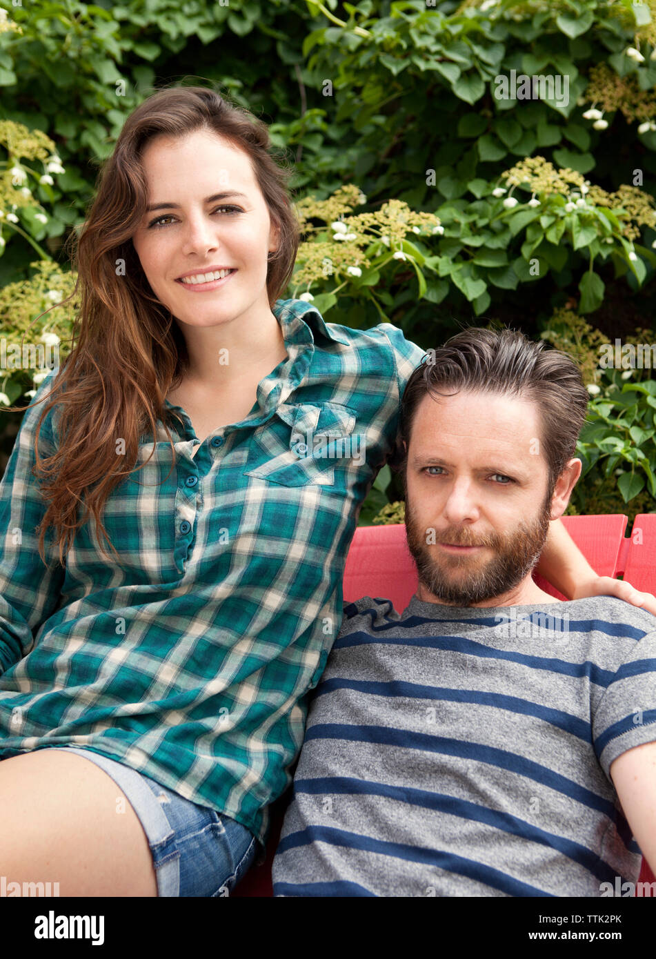 Couple sitting on chair hi-res stock photography and images - Alamy