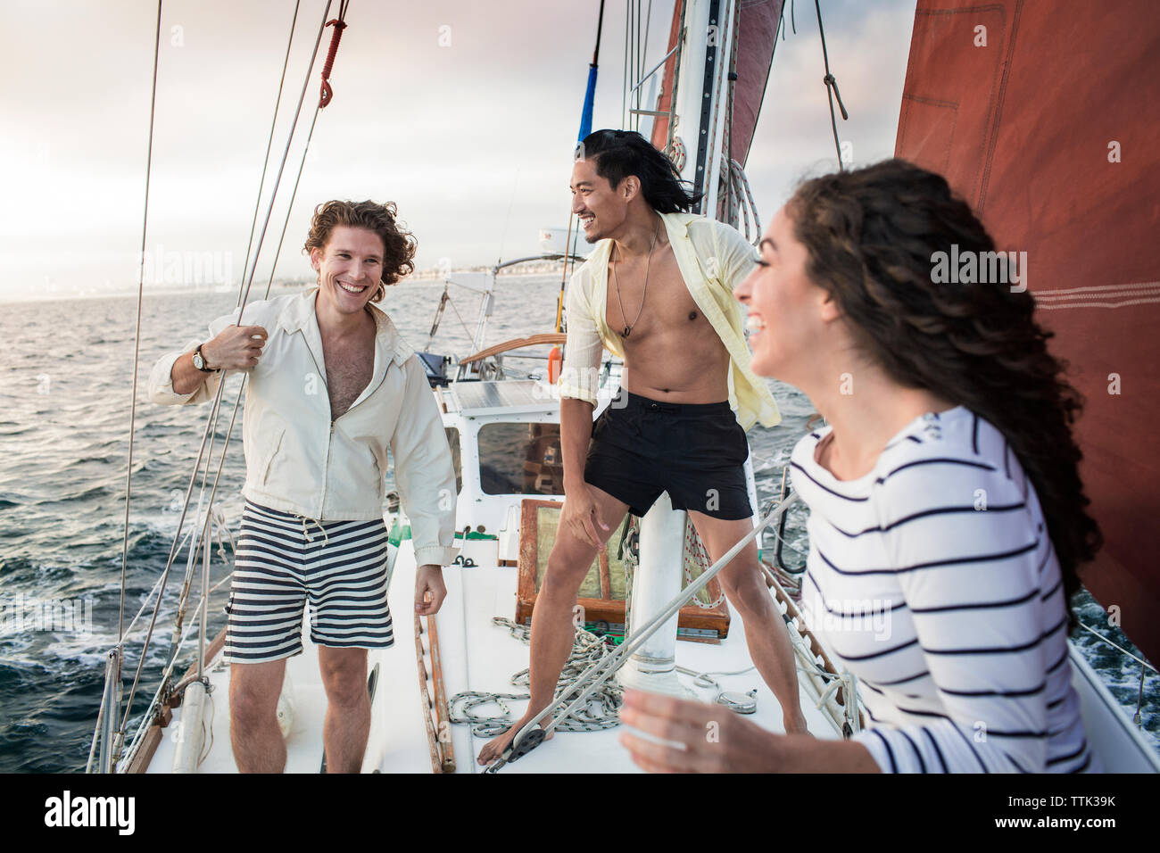 Friends enjoying on sailboat Stock Photo - Alamy