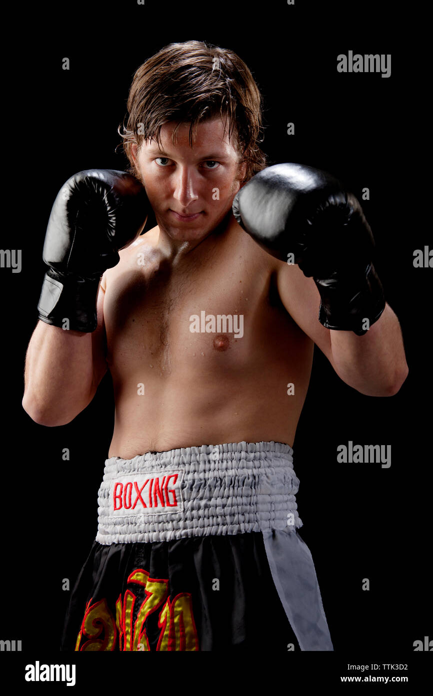 Portrait of boxer against black background Stock Photo - Alamy