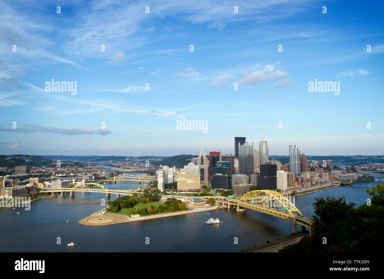 High angle view of bridges over river in Pittsburgh city against blue ...