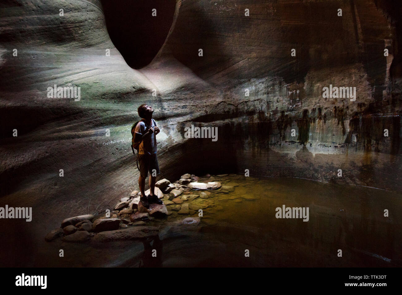 Man standing in cave hi-res stock photography and images - Alamy
