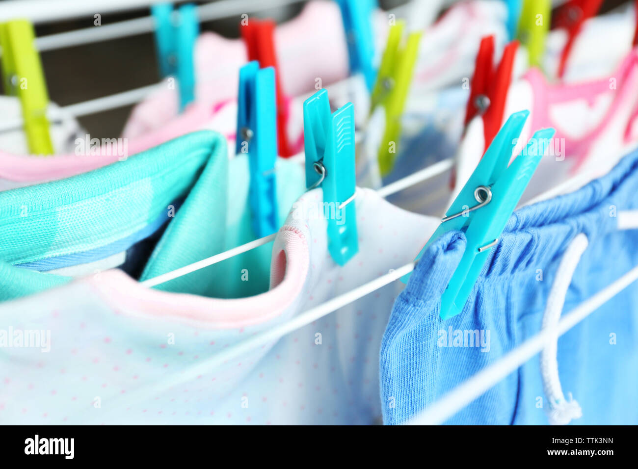 Drying baby clothes hi-res stock photography and images - Alamy