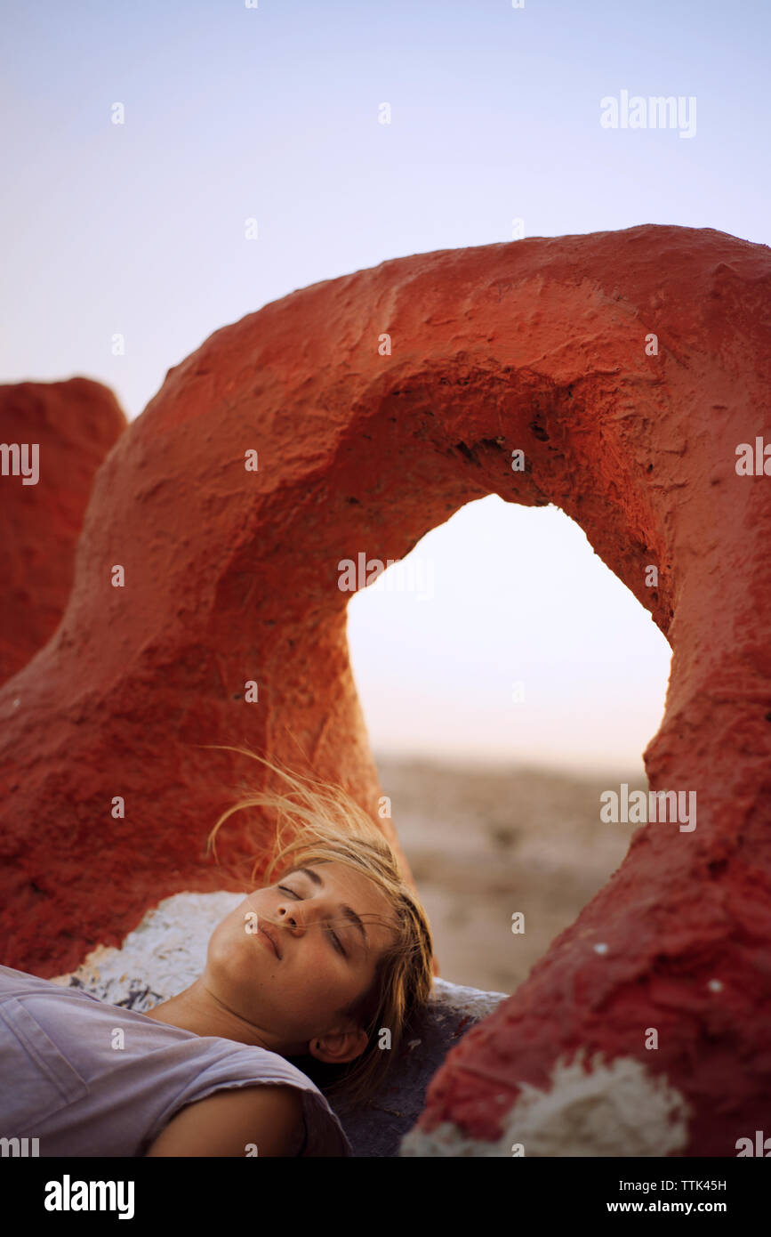 Woman lying on rock hi-res stock photography and images - Alamy