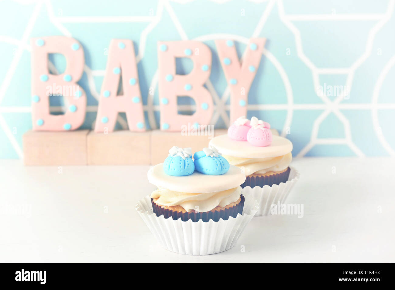 Word "Baby" with cupcakes on bright background Stock Photo - Alamy