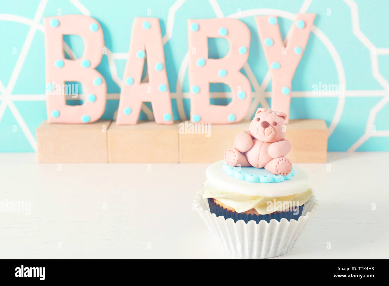 Word "Baby" with cupcake on bright background Stock Photo - Alamy