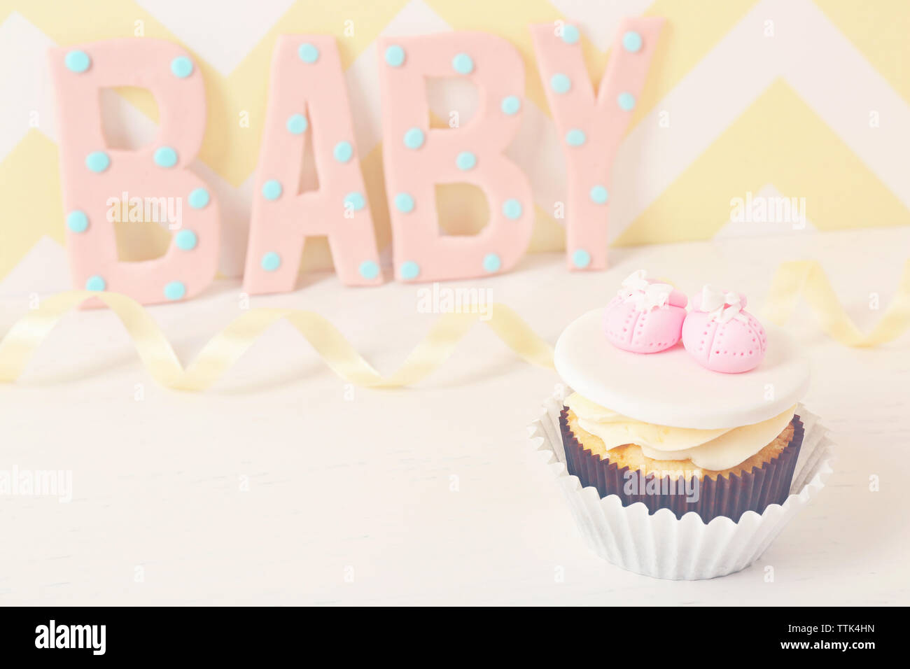 Word "Baby" with cupcake on bright background Stock Photo - Alamy