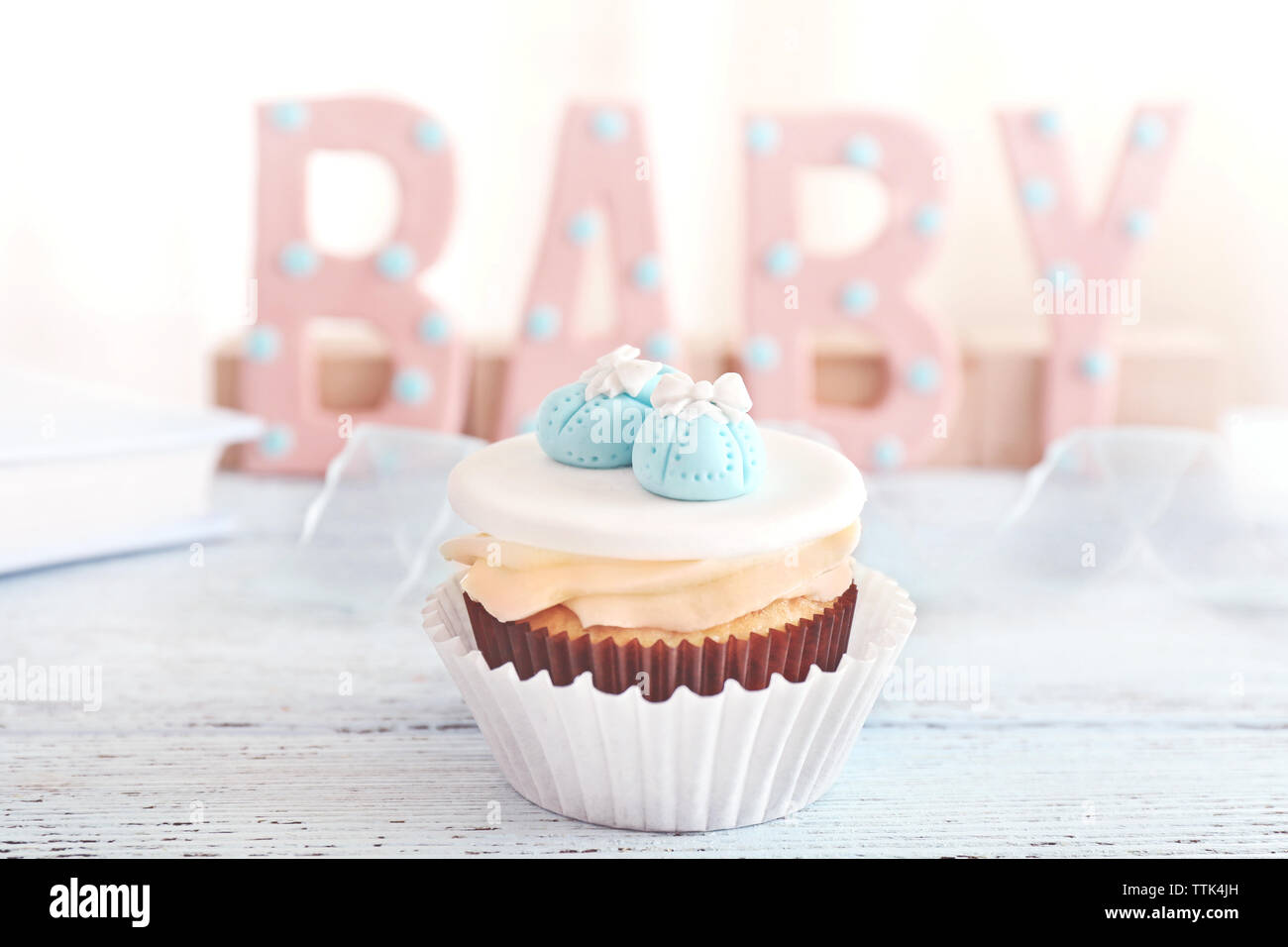 Word "Baby" with cupcake on light background Stock Photo - Alamy