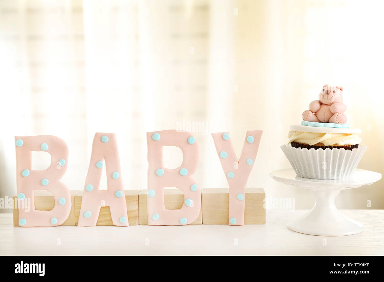 Word "Baby" with cupcake on light background Stock Photo - Alamy