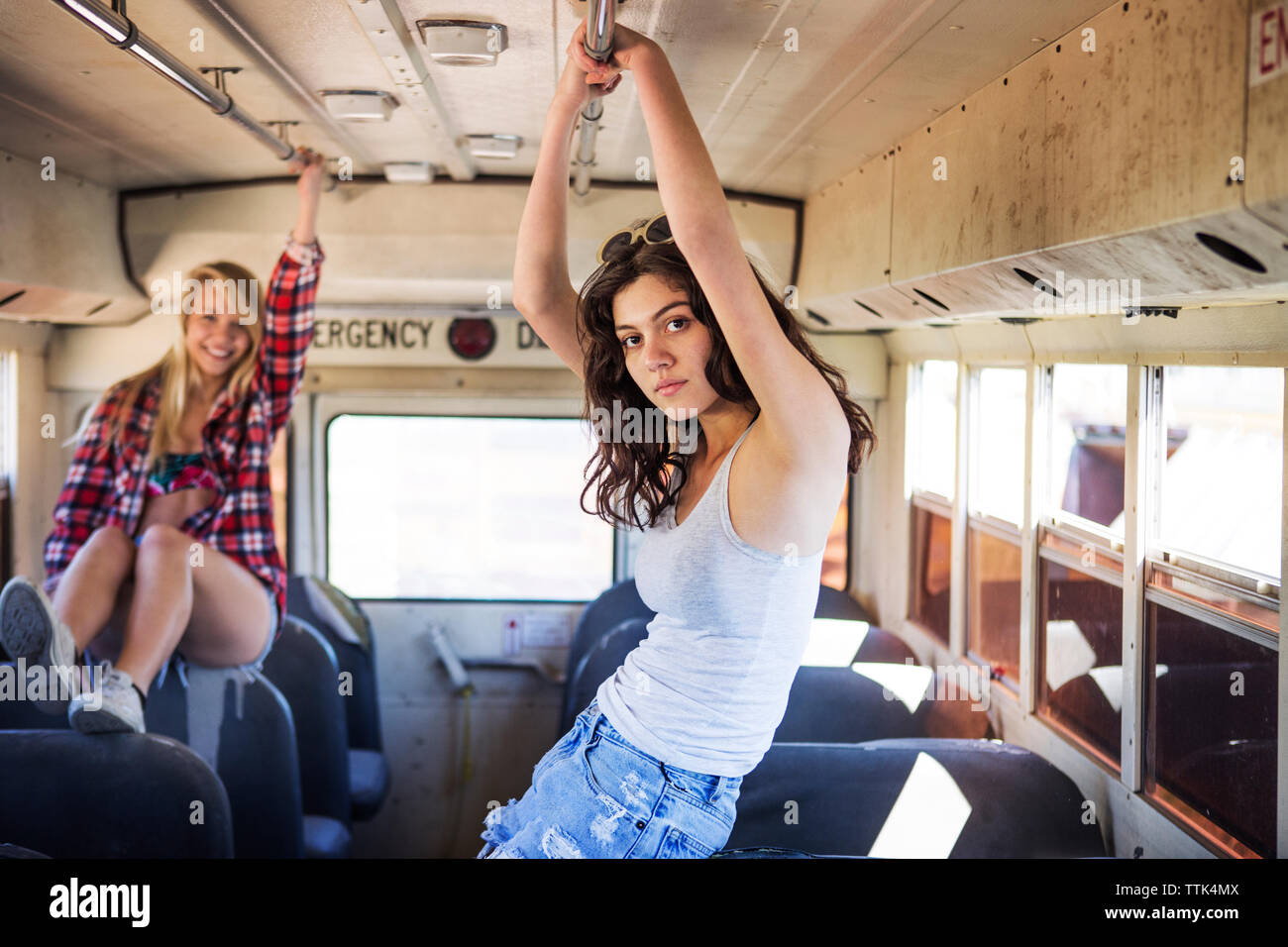 Portrait of woman with happy friend in old bus Stock Photo - Alamy