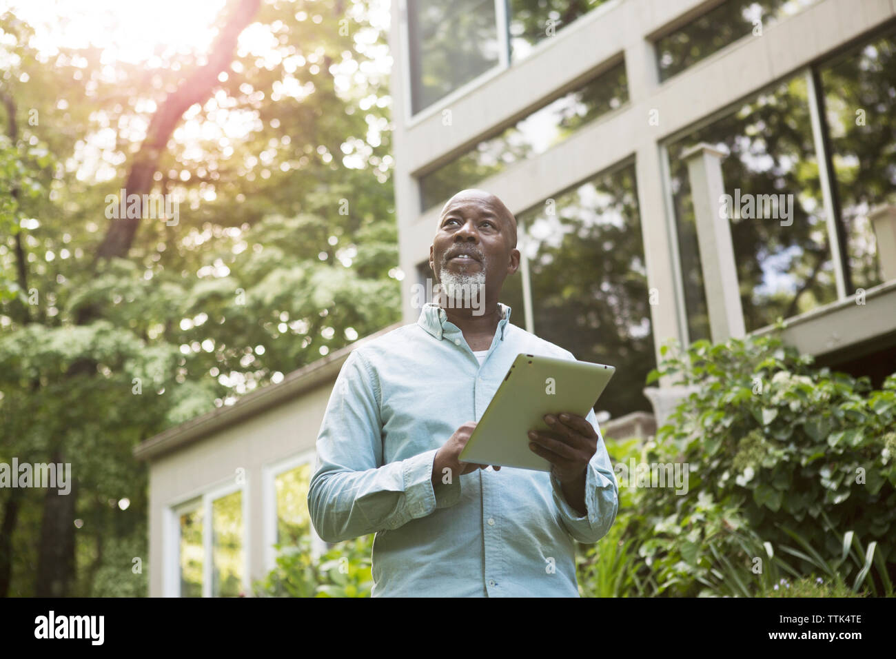 Man sitting outside his home hi-res stock photography and images - Alamy