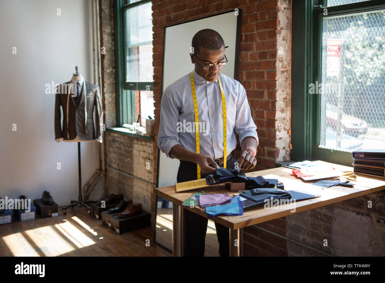 Tailor fabrics suit hi-res stock photography and images - Alamy