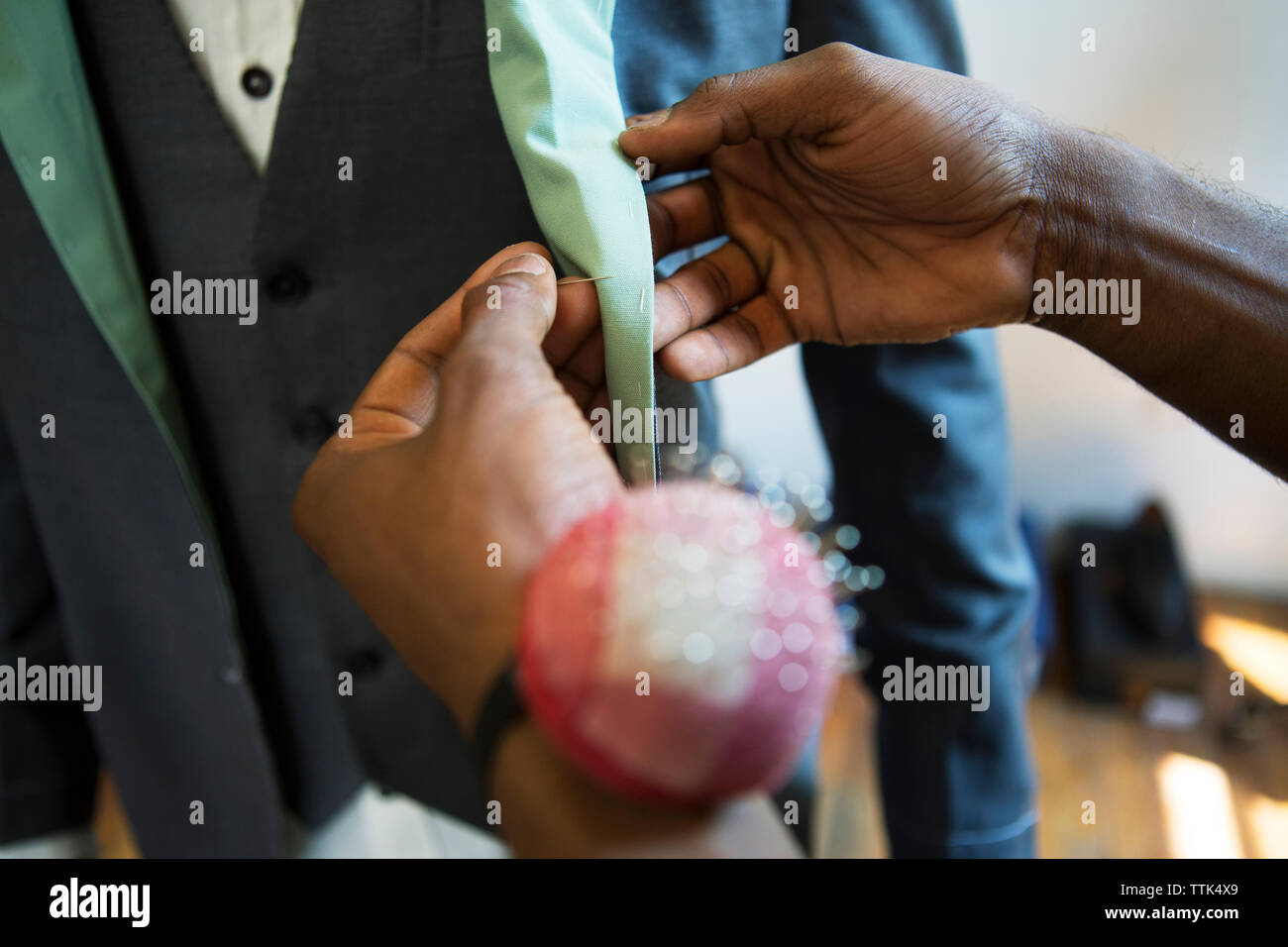 Tailor pinning suit hi-res stock photography and images - Alamy