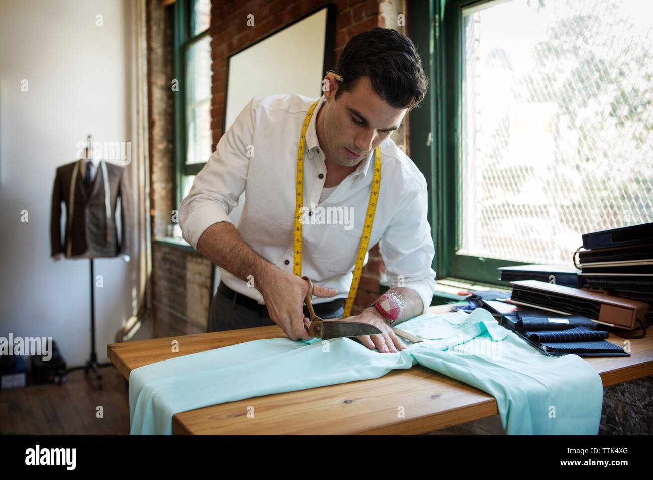 Cutting fabric hi-res stock photography and images - Alamy