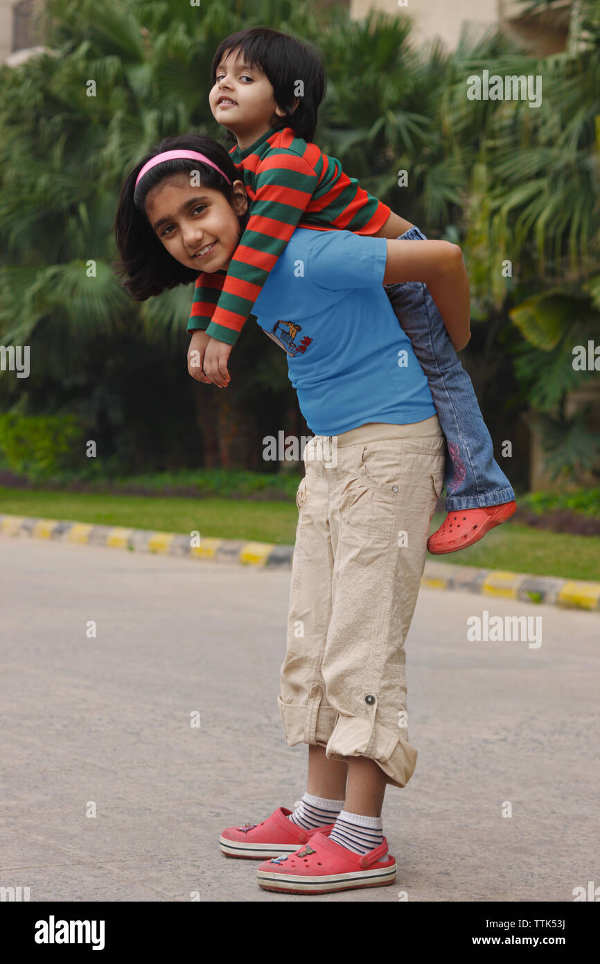 Girl riding piggyback hi-res stock photography and images - Alamy