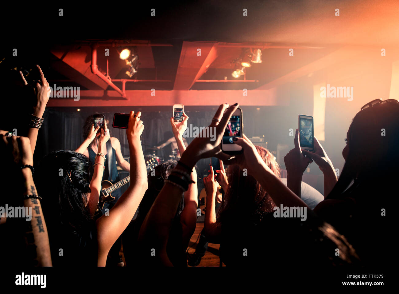 Fans photographing musicians performing at studio Stock Photo - Alamy