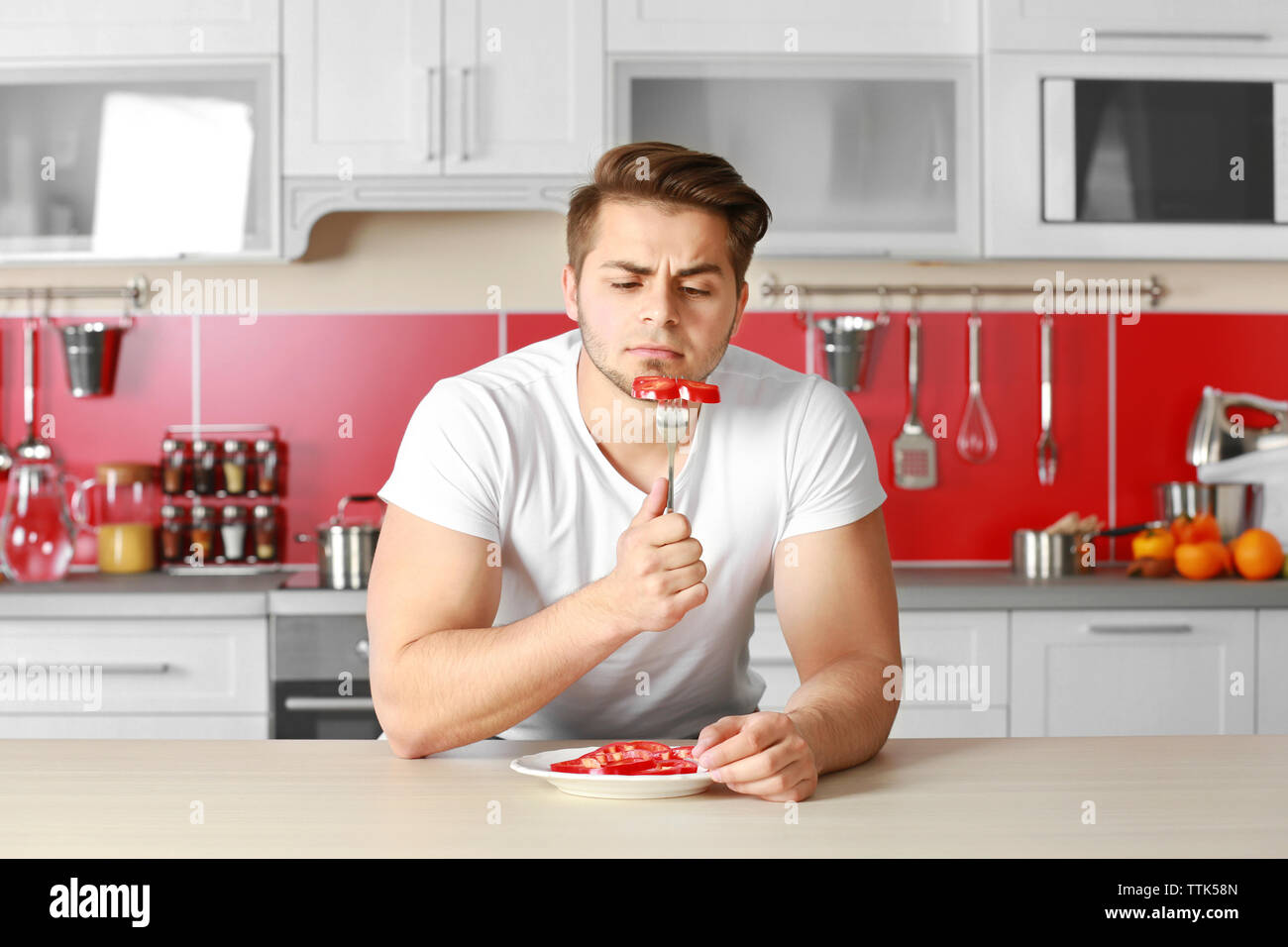 Man and healthy food in kitchen Stock Photo - Alamy