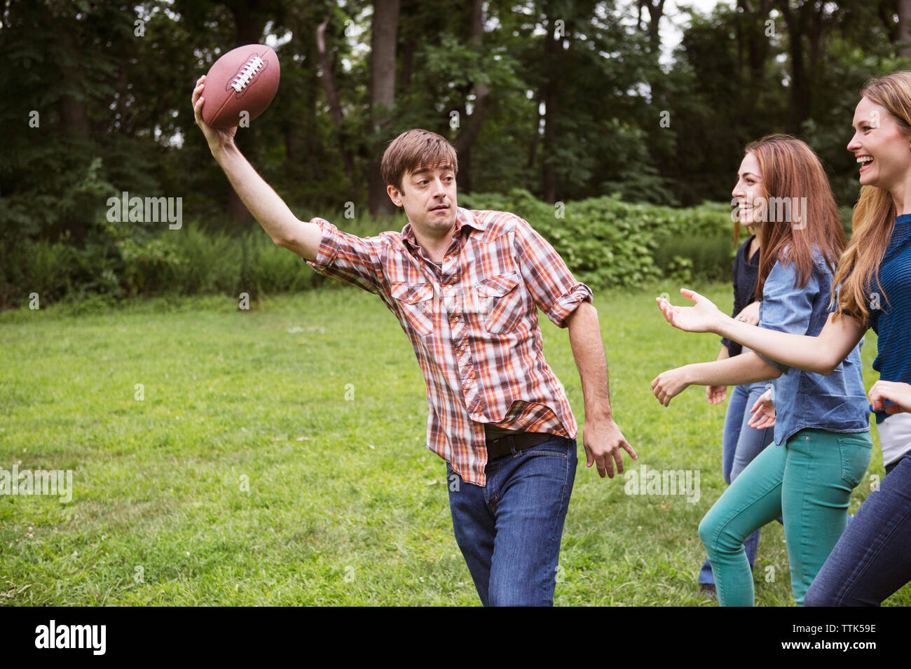 Football throwing adults hi-res stock photography and images - Alamy