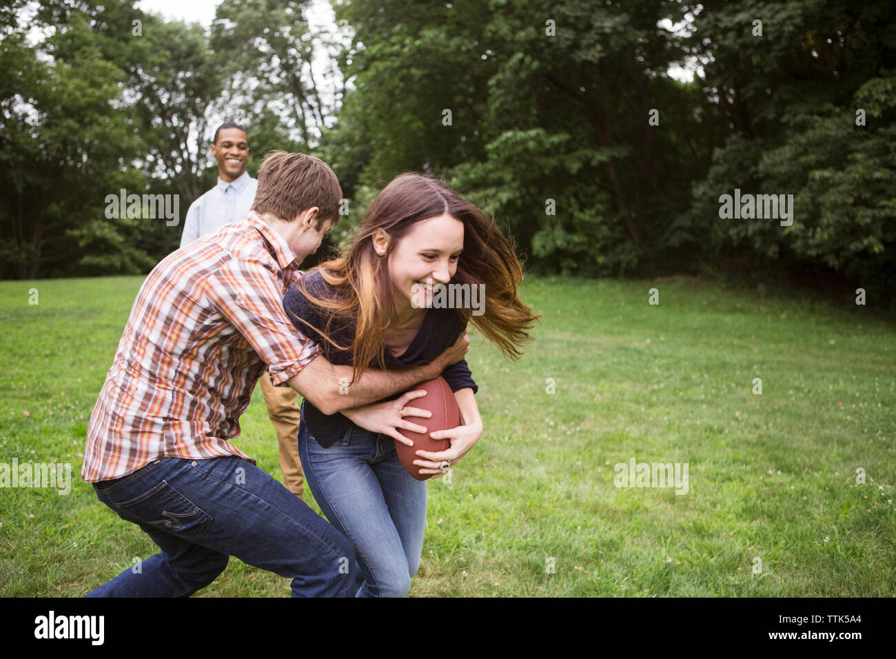 Woman pulling man hi-res stock photography and images - Alamy