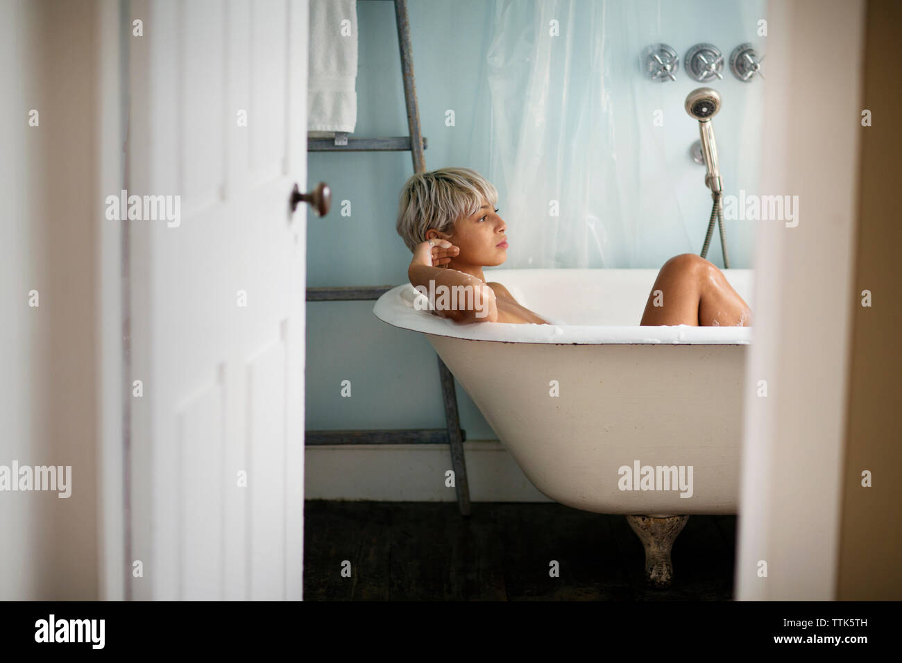Woman taking bath home hi-res stock photography and images - Alamy