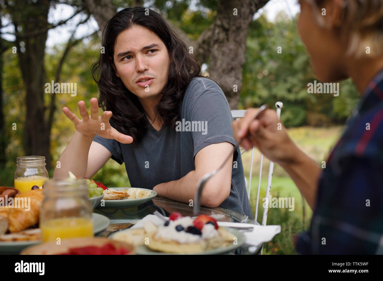 Two man friends talking hi-res stock photography and images - Alamy