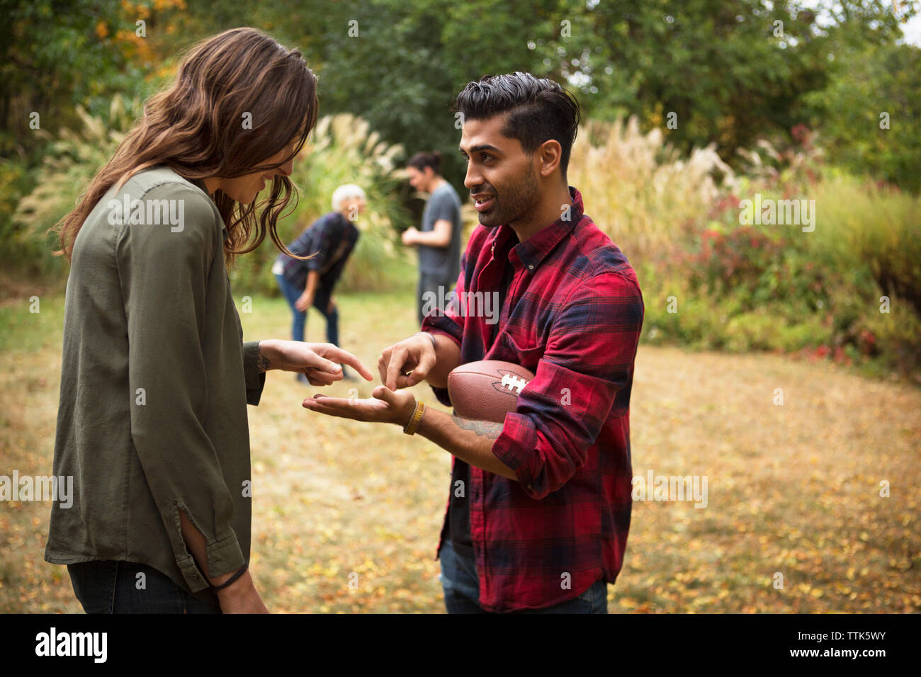 Man explaining football to woman hi-res stock photography and images ...