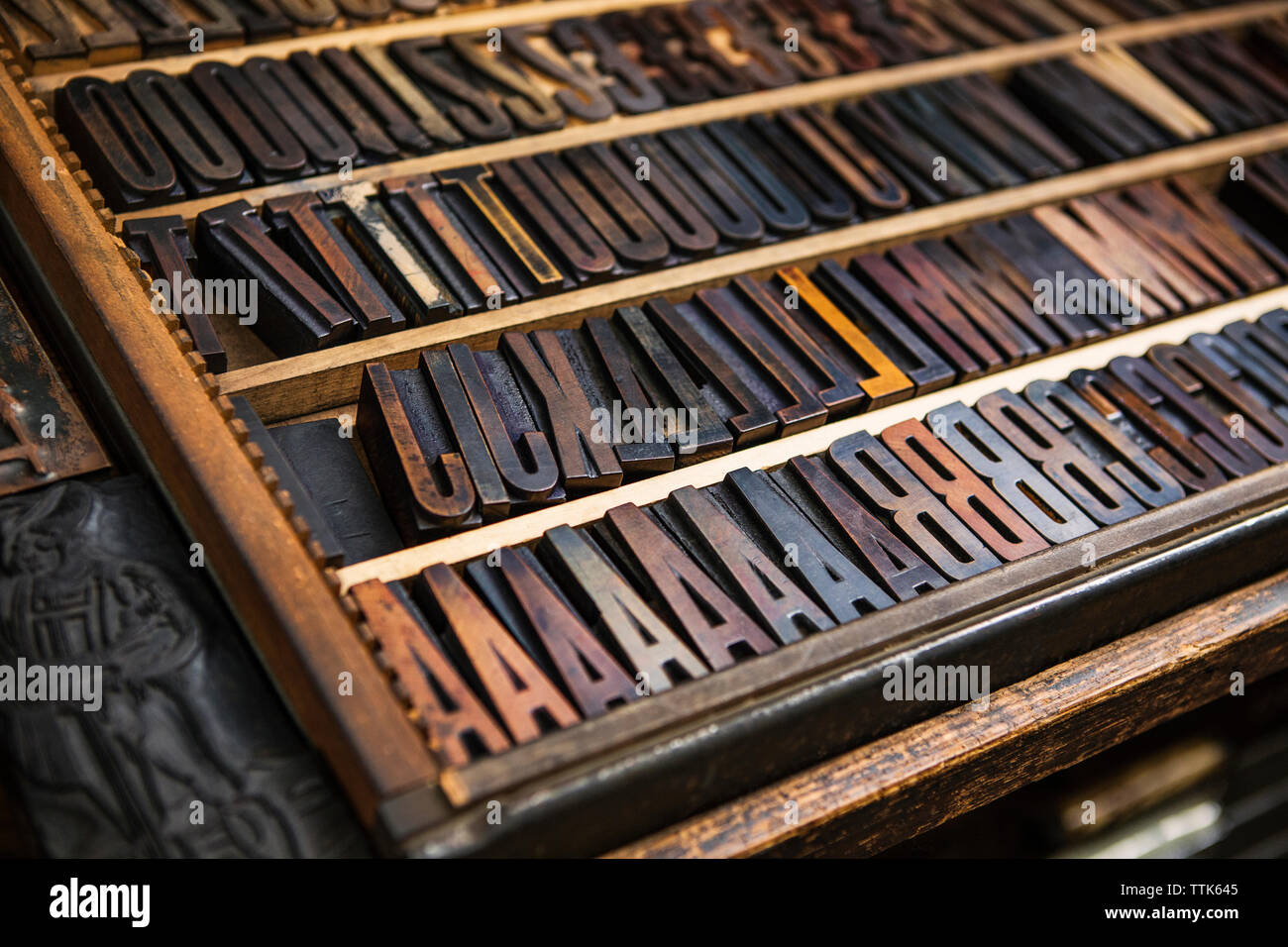 Close-up of alphabets and numbers letterpress in tray at workshop Stock ...