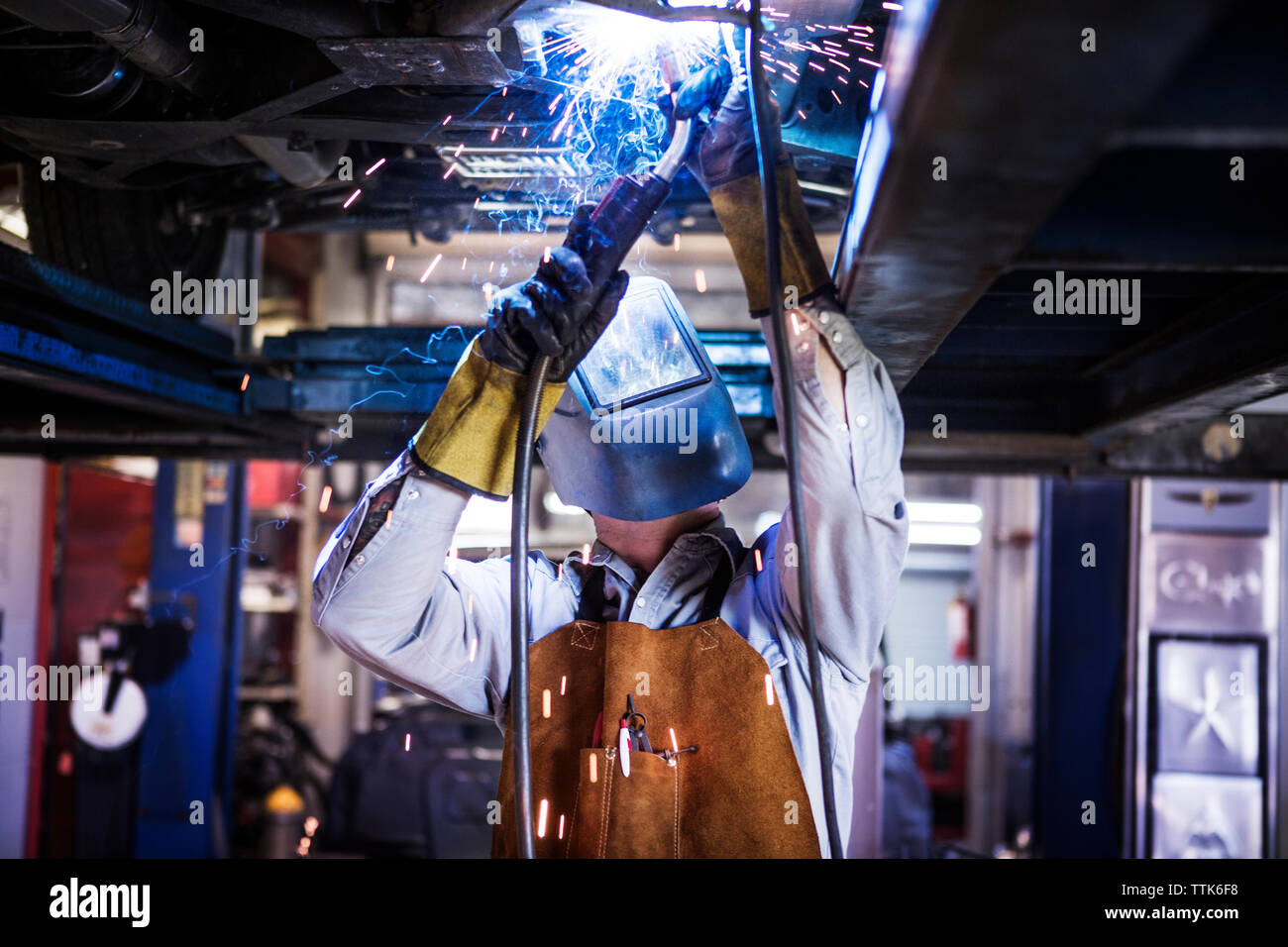 Mechanic in welding helmet hi-res stock photography and images - Alamy