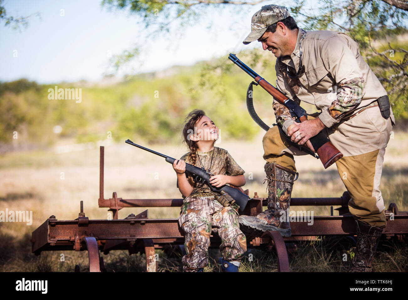 Smiling looking sitting holding hi-res stock photography and images - Alamy