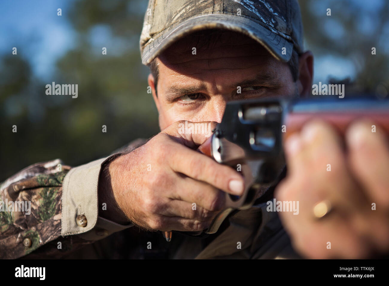 Close-up of man hunting with rifle Stock Photo - Alamy