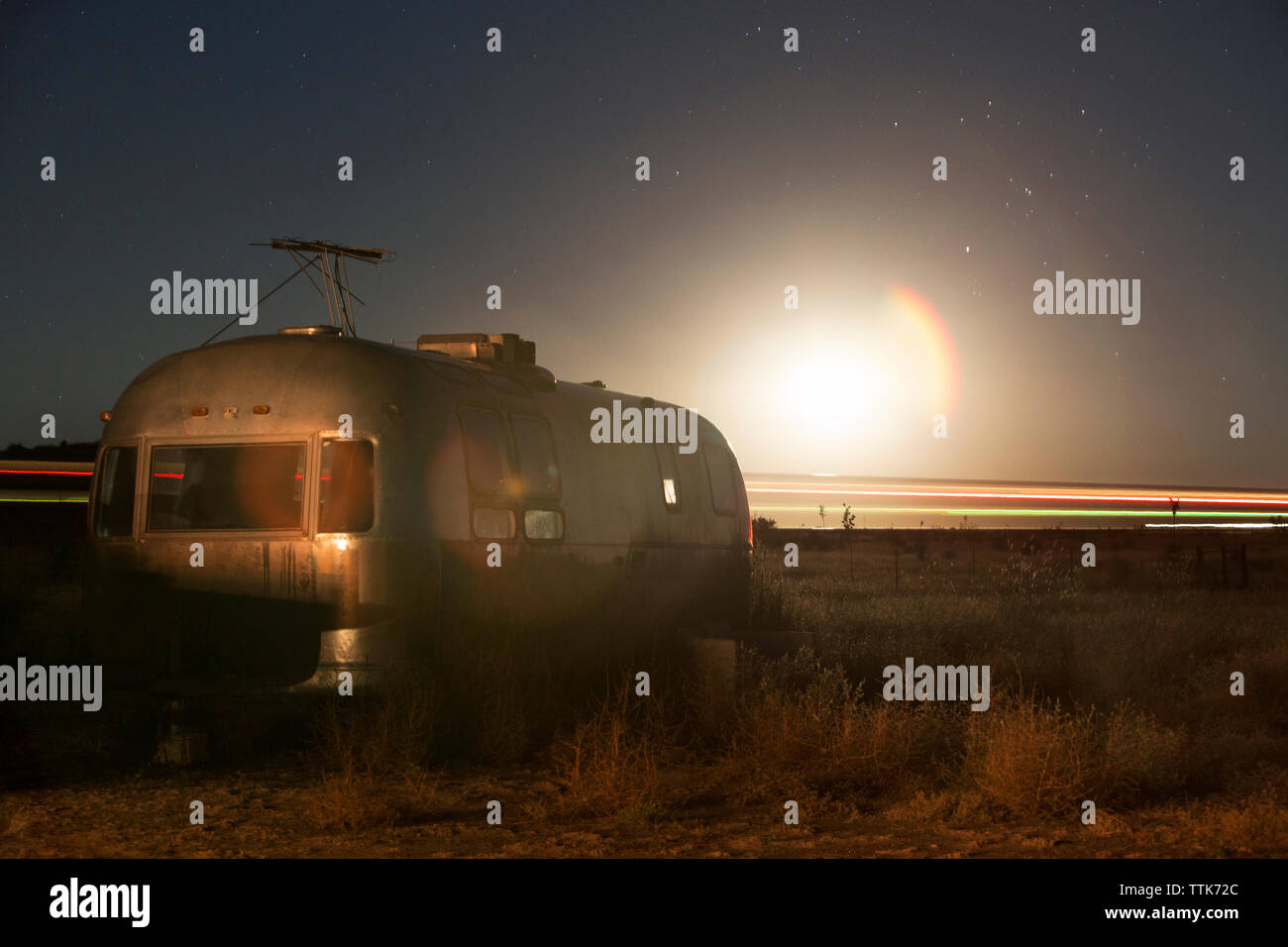 Motor home on field at night Stock Photo - Alamy