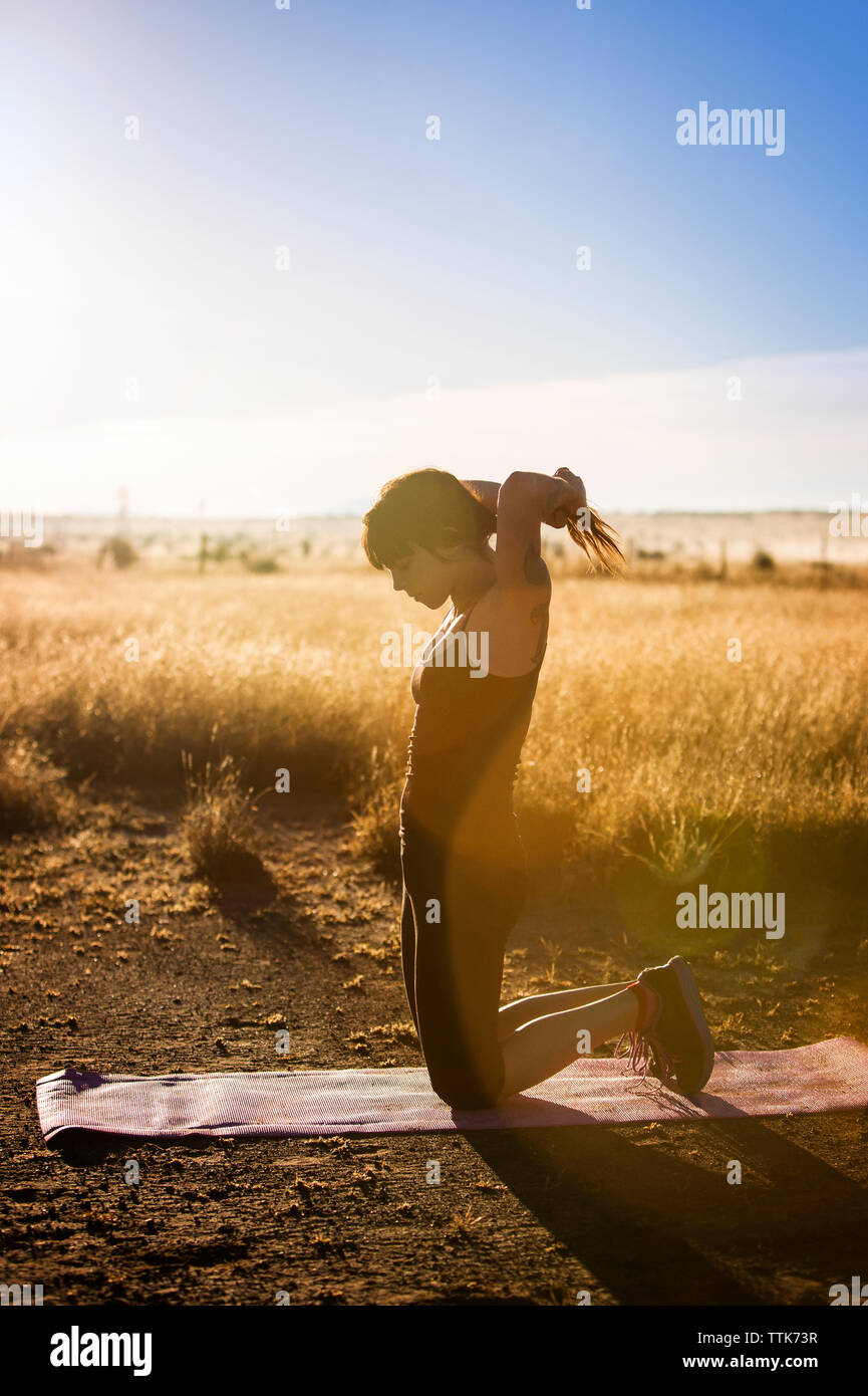 Side profile young woman kneeling hi-res stock photography and images ...