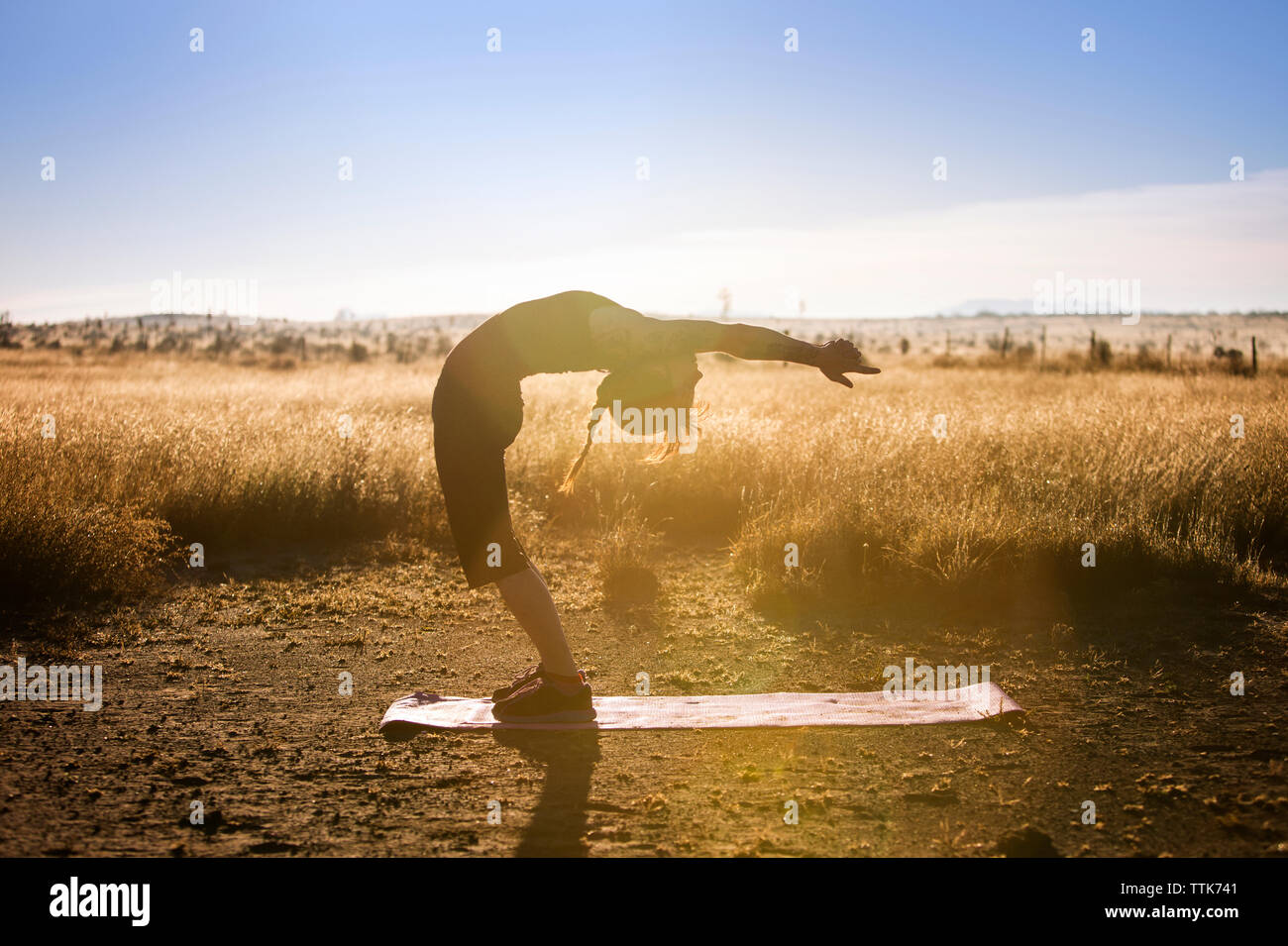 Young woman bending over outdoors hi-res stock photography and images ...